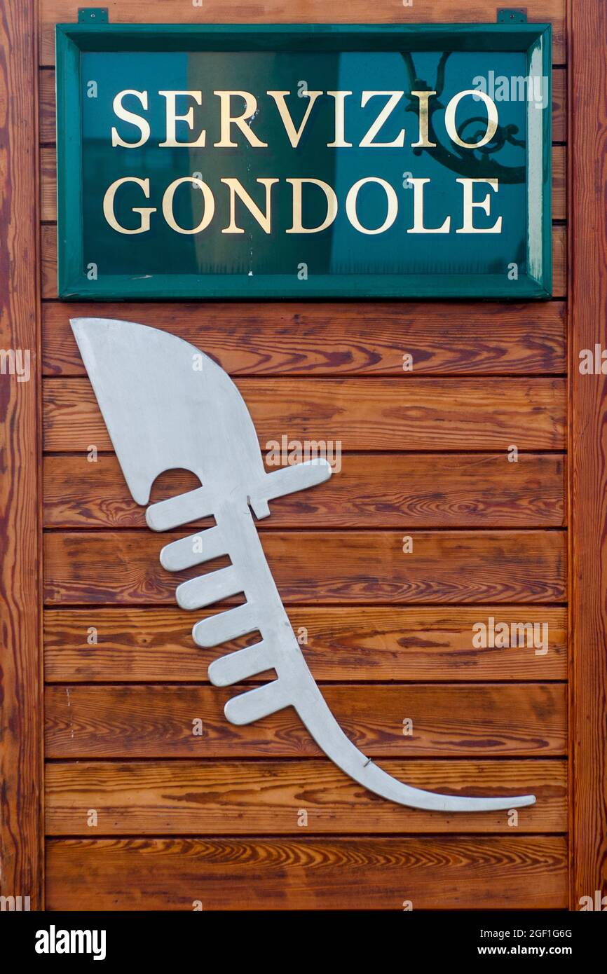 A vertical shot of gondola service sign and logo on the wooden ...