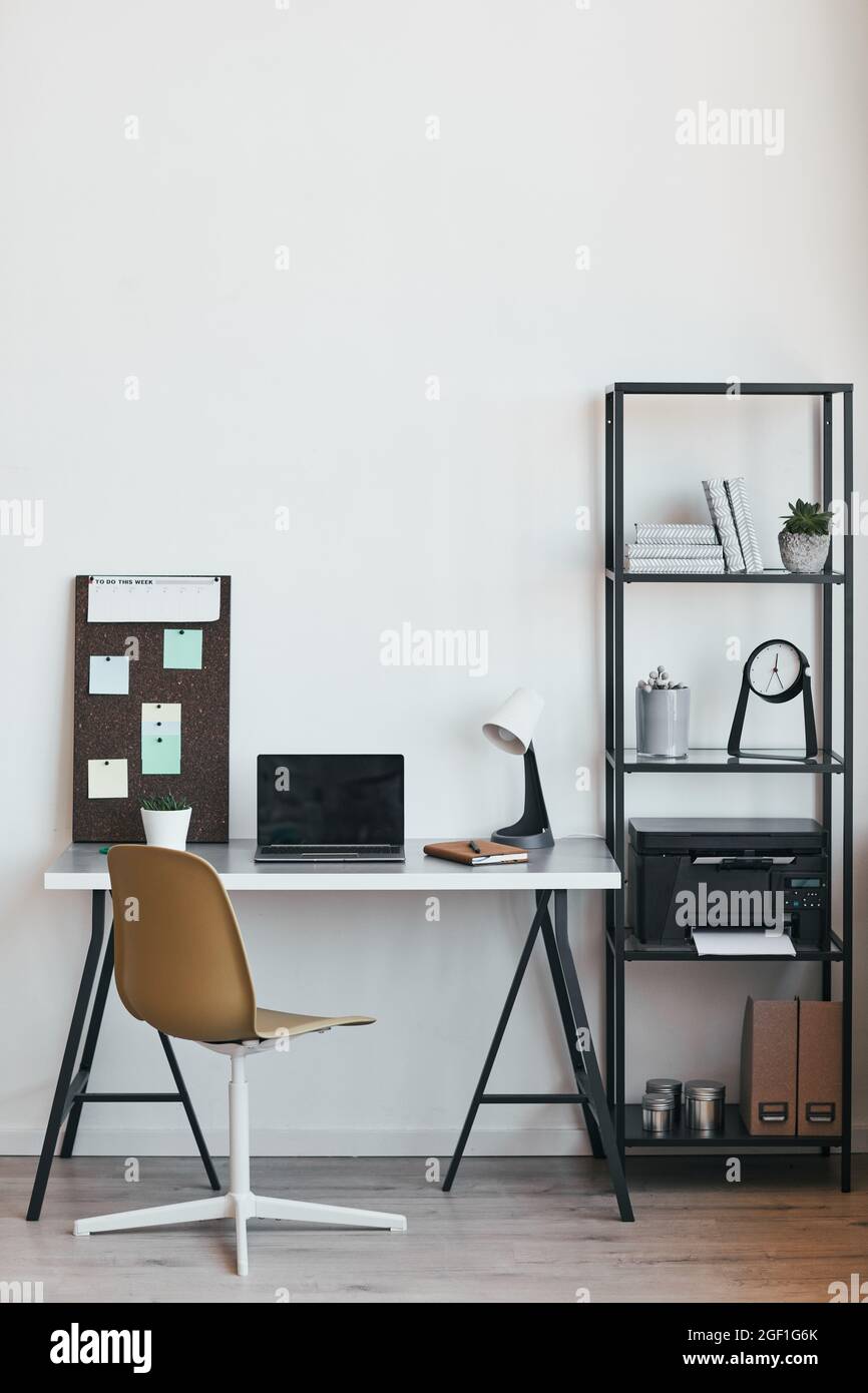 Vertical background image of minimal home office workplace with laptop ...