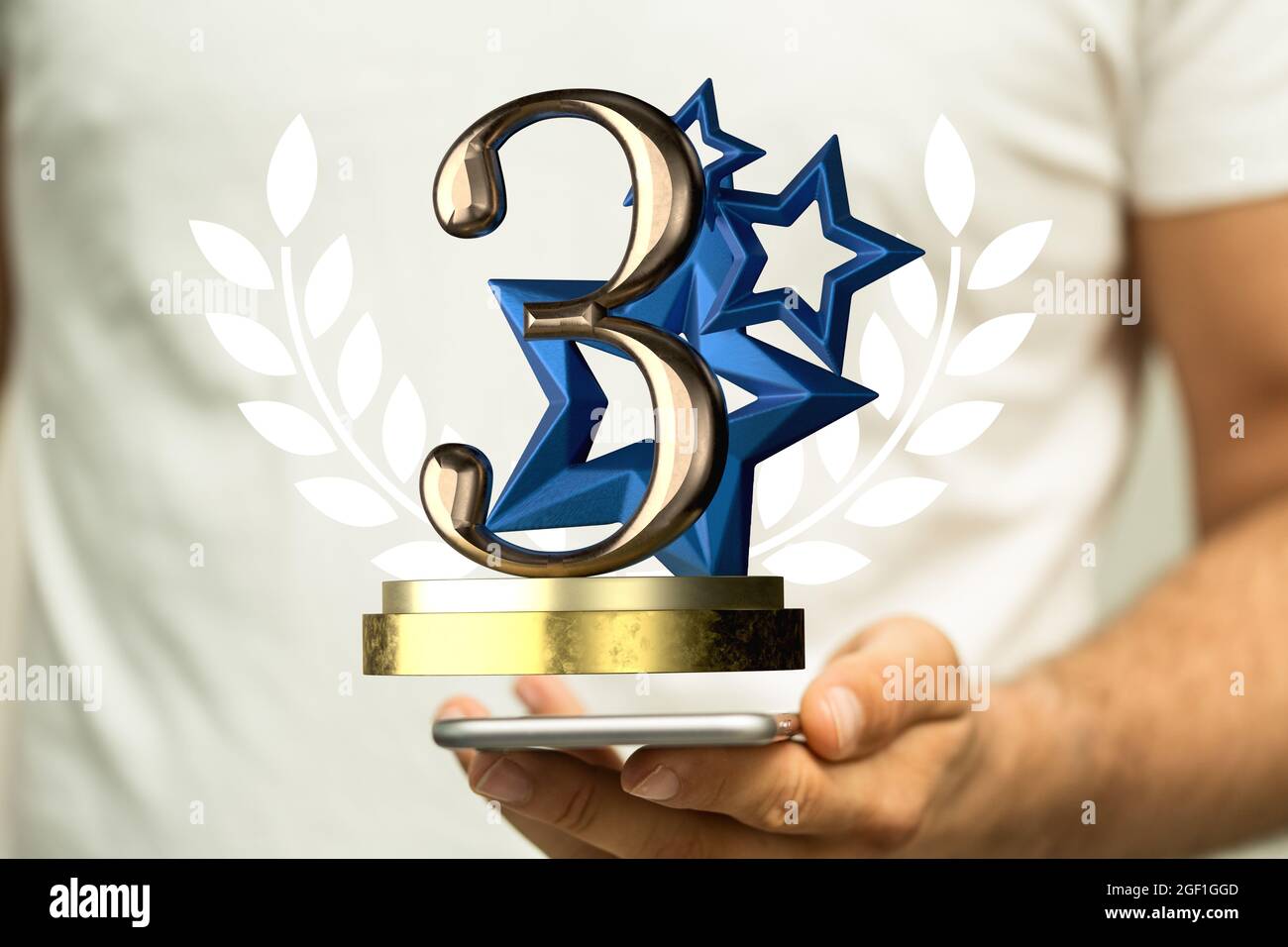 A 3d rendered 3rd place reward with olive wreath in male hand Stock ...