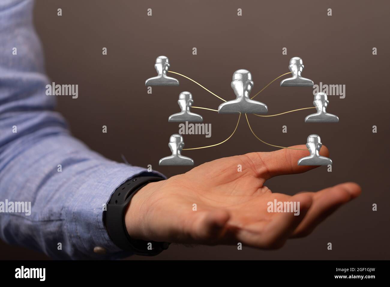 The 3D rendered network of people over the hand of a male-hierarchy ...
