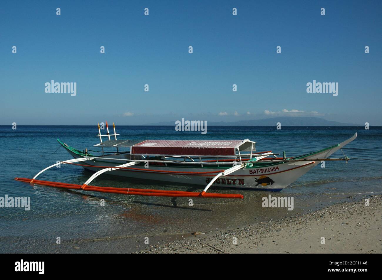 MINDORO, PHILIPPINES - Jan 12, 2007: A fishing boat parked on the sandy ...