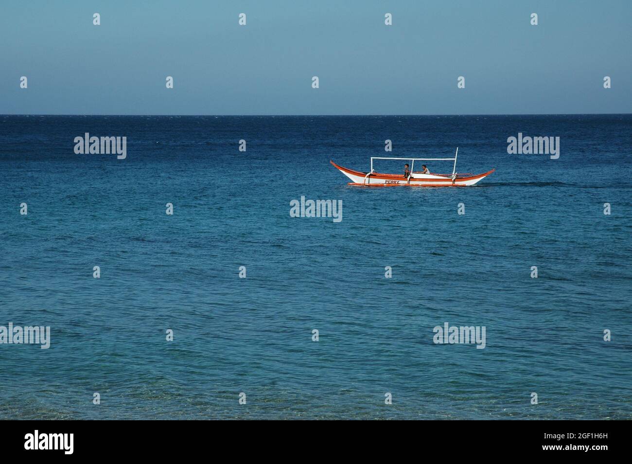 MINDORO, PHILIPPINES - Jan 12, 2007: A fishing ship on the wavy sea ...