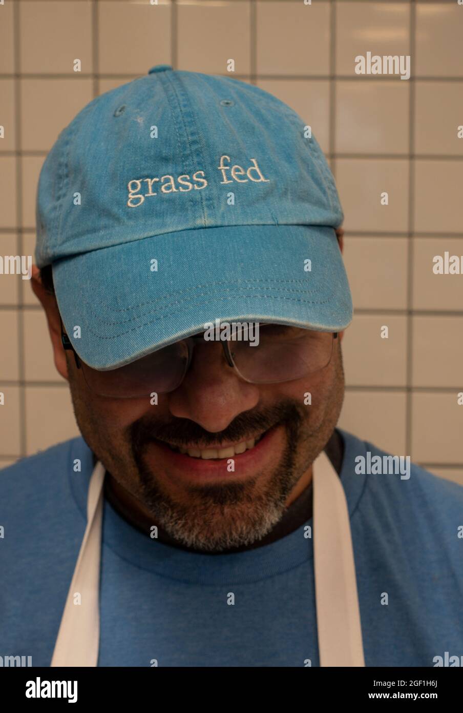 butcher wearing grass fed hat in Williamsburg Brooklyn store NYC Stock ...