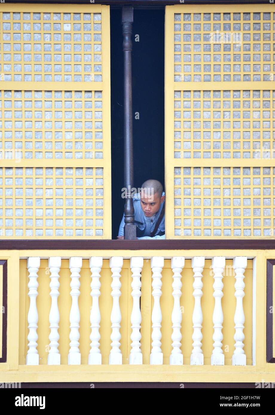 MANILA, PHILIPPINES - Sep 23, 2012: An man in window of an vintage ...