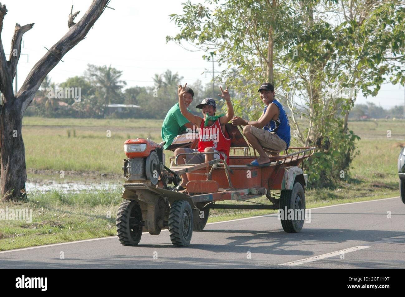 BANAUE, PHILIPPINES - Nov 01, 2019: The boys on the traditional farmer ...