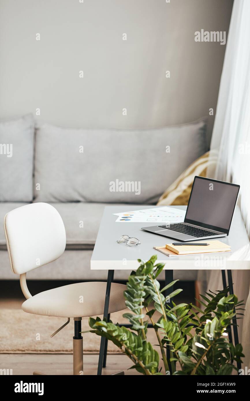 Vertical background image of cozy home office interior in white color ...