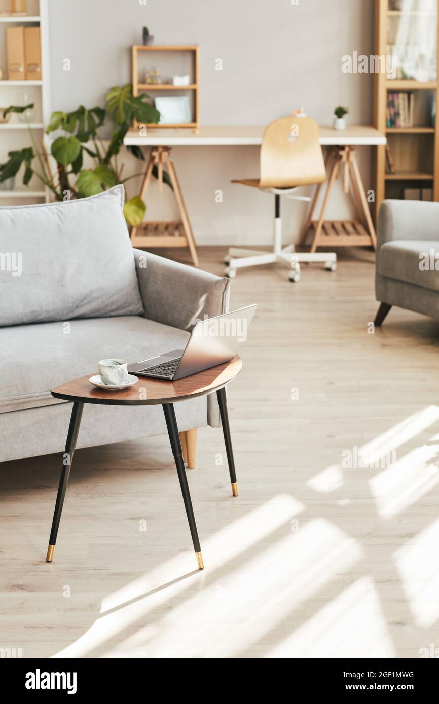 Vertical background image of cozy home interior lit by sunlight with ...