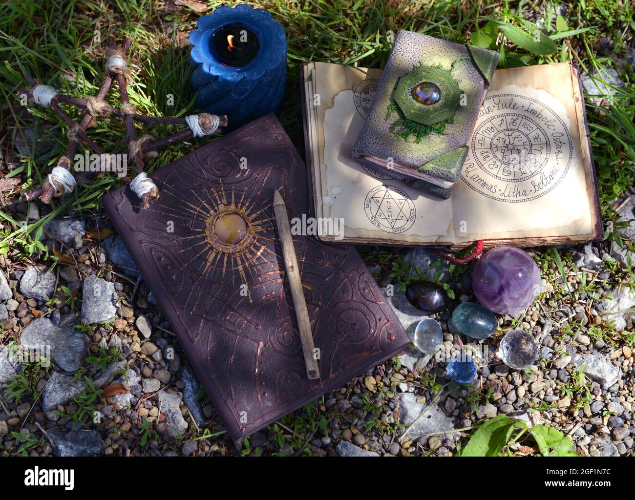 Still life with witch manuscripts and books, crystal and candles in the ...