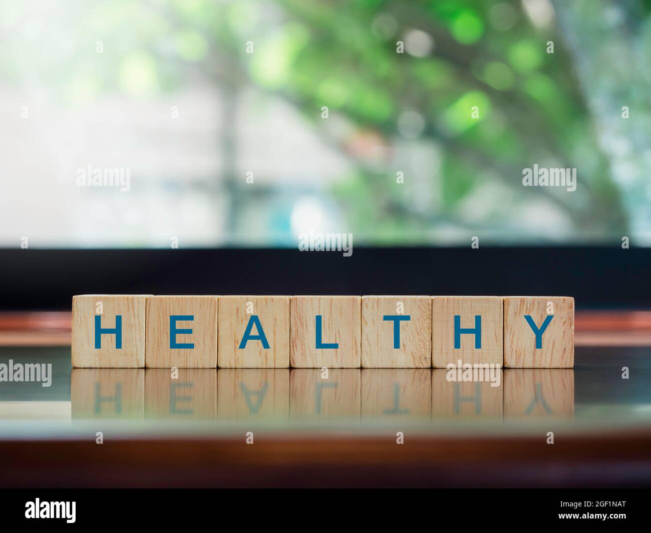 Healthy, words on wooden cube blocks on brown wood desk background ...