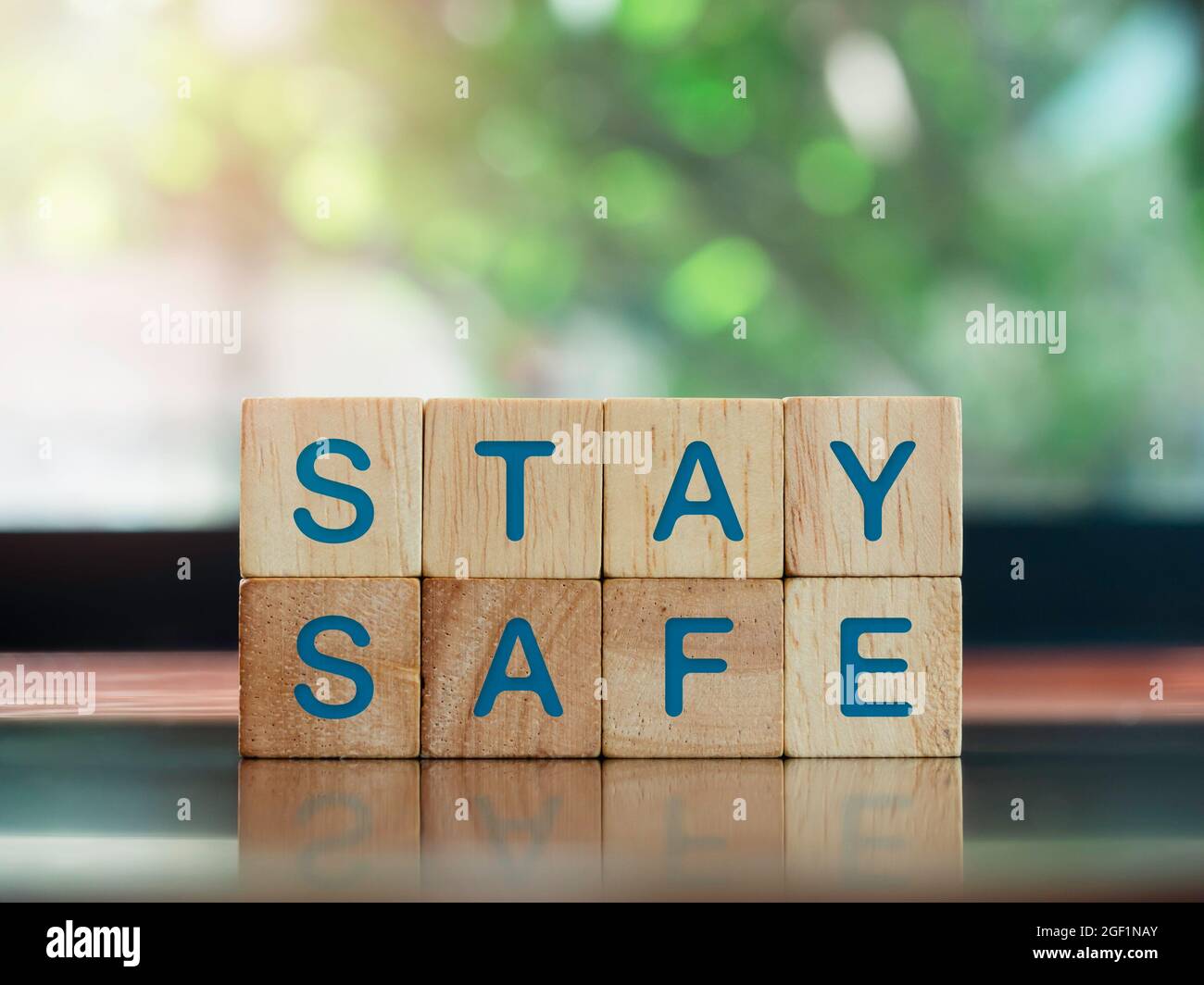 Stay safe, blue words on wooden cube blocks on brown wood desk and ...