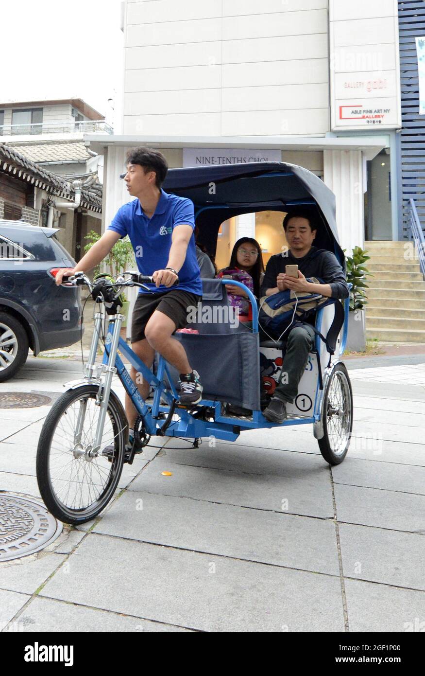 A cycle rickshaw in the Bukchon Hanok village in Seoul, Korea Stock ...