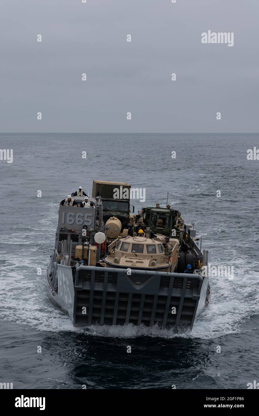 PACIFIC OCEAN (August 6, 2021) Landing Craft Utility 1665, attached to ...