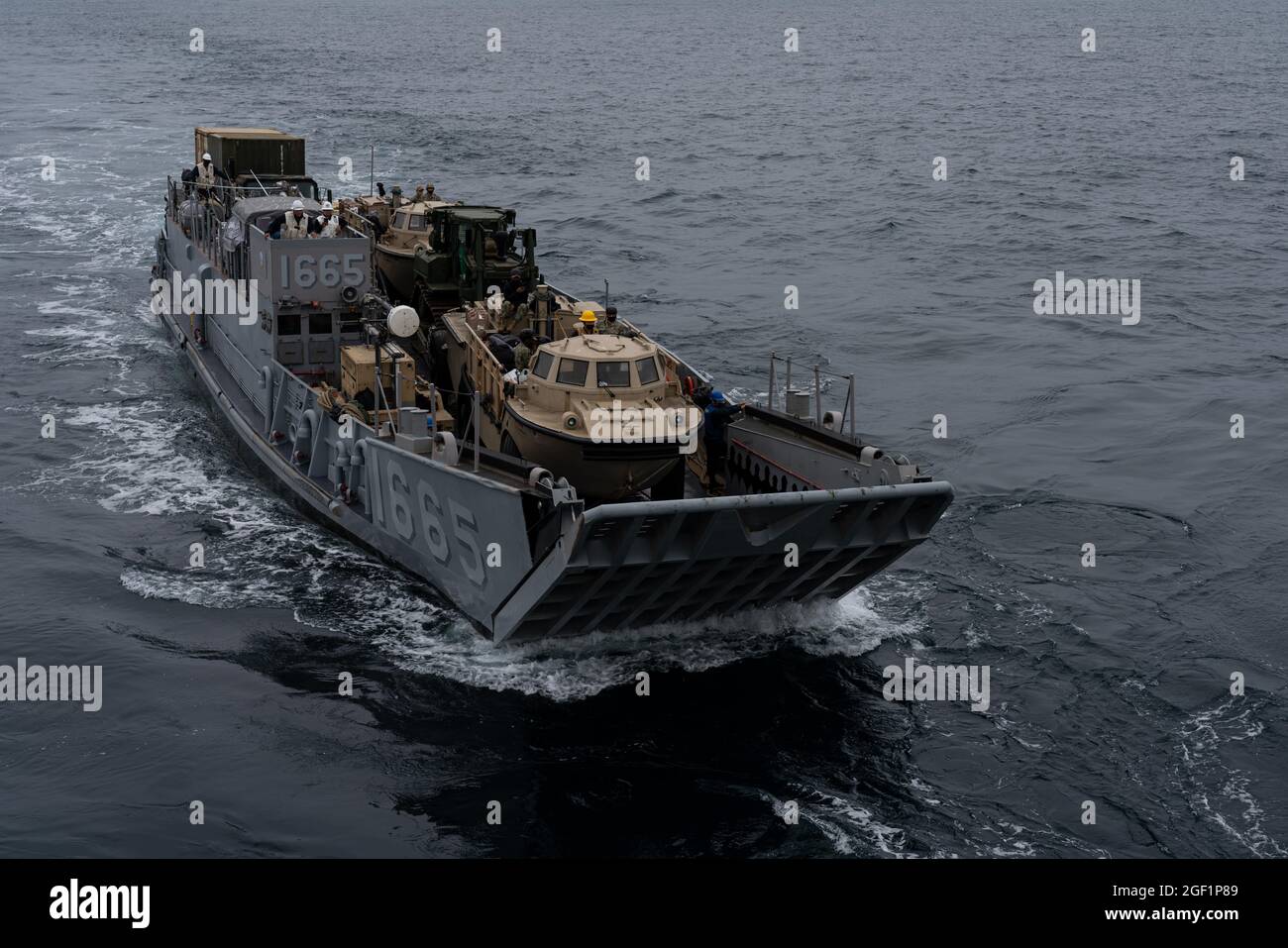PACIFIC OCEAN (August 6, 2021) Landing Craft Utility 1665, attached to ...