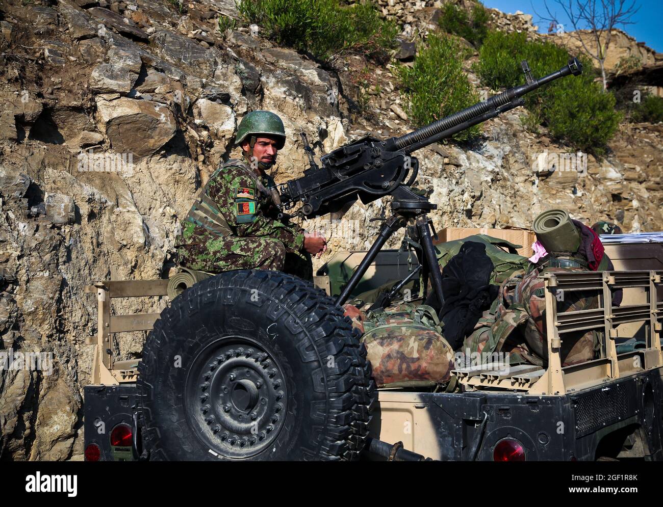 An Afghan National Army soldier provides over watch security over the ...