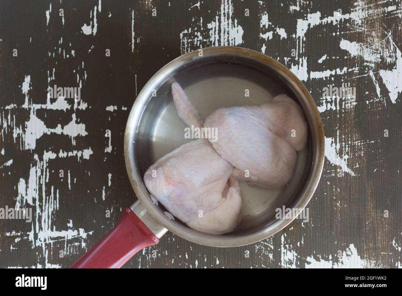 Top view of raw chicken wings in pan with water before cooking Stock ...