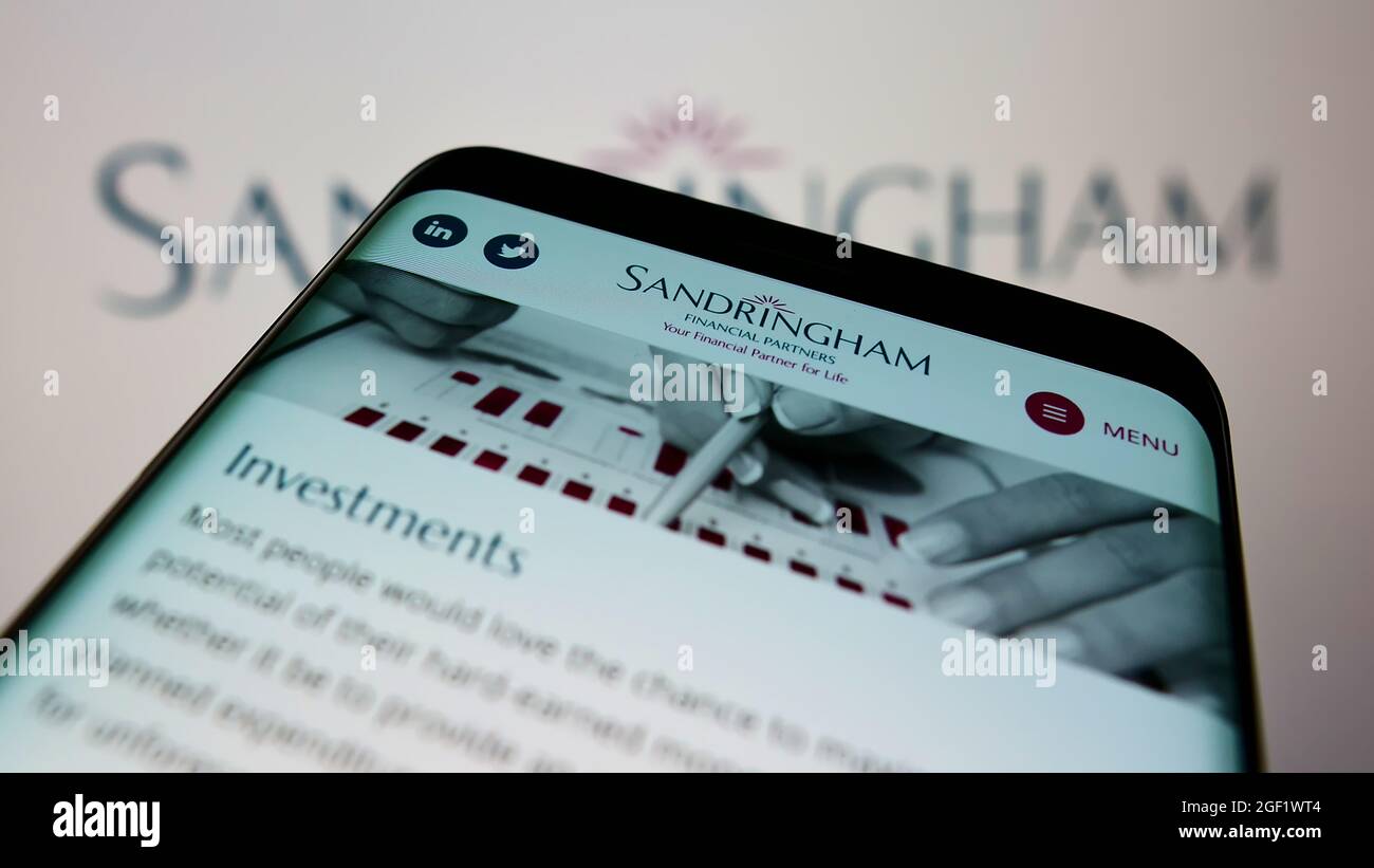 Mobile phone with webpage of British company Sandringham Financial ...