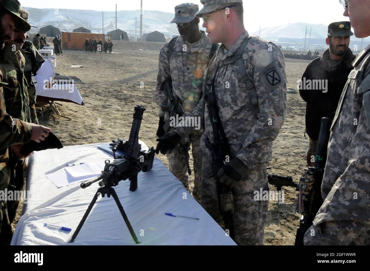 U.S. Army advisors talk with Afghan National Army trainers at the Kabul ...