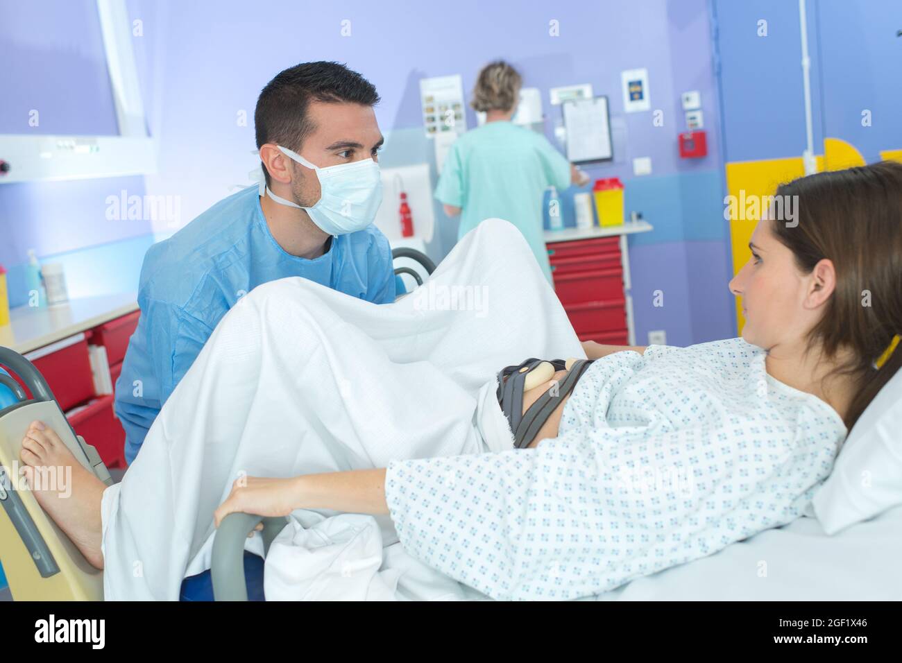 woman having contraction giving birth in hospital Stock Photo - Alamy