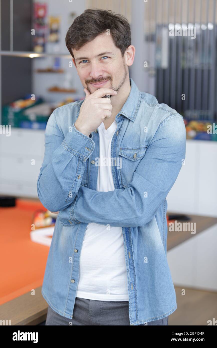 a casual man posing casually Stock Photo - Alamy