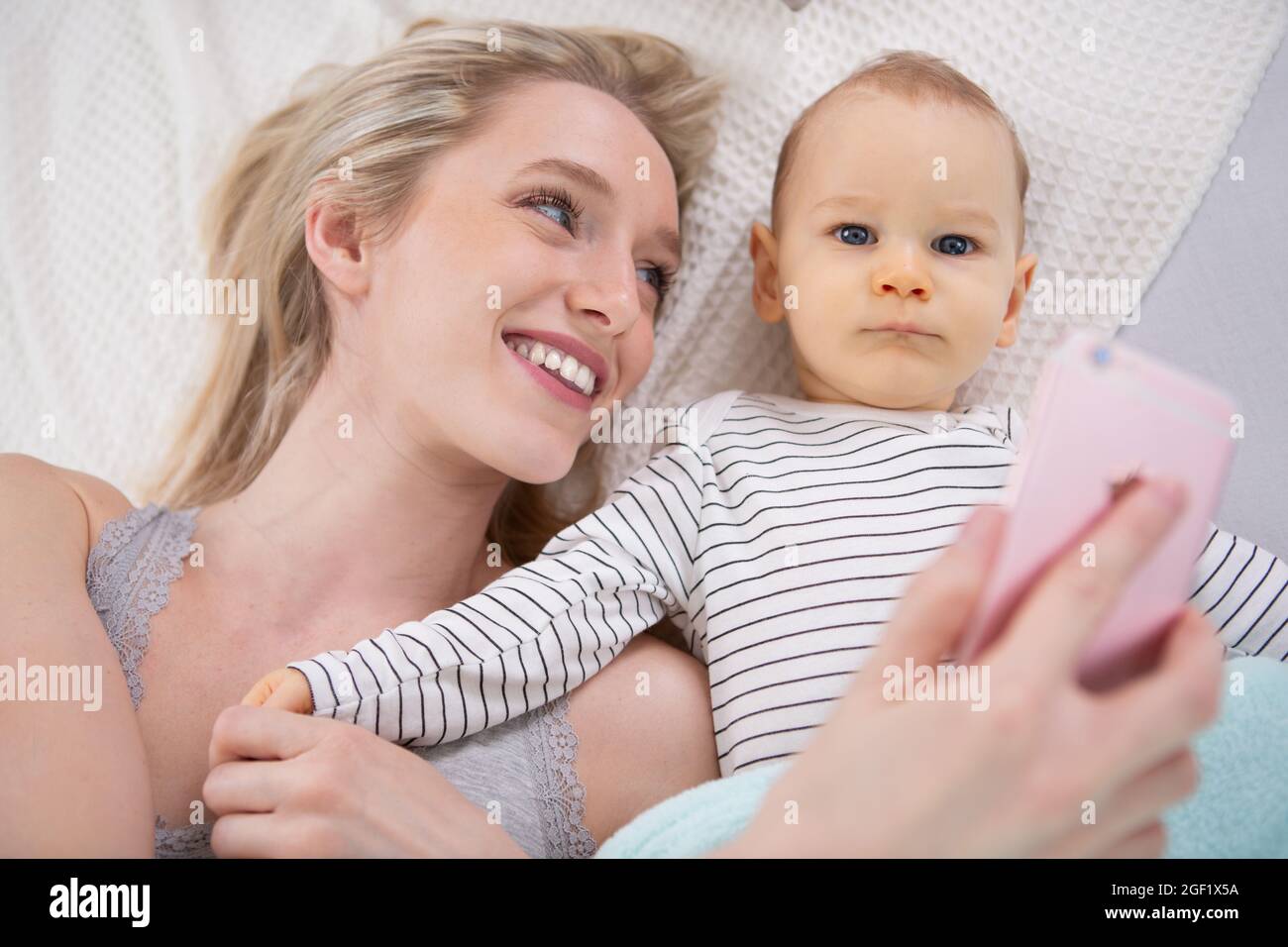 funny baby and mum make selfie on mobile phone Stock Photo - Alamy