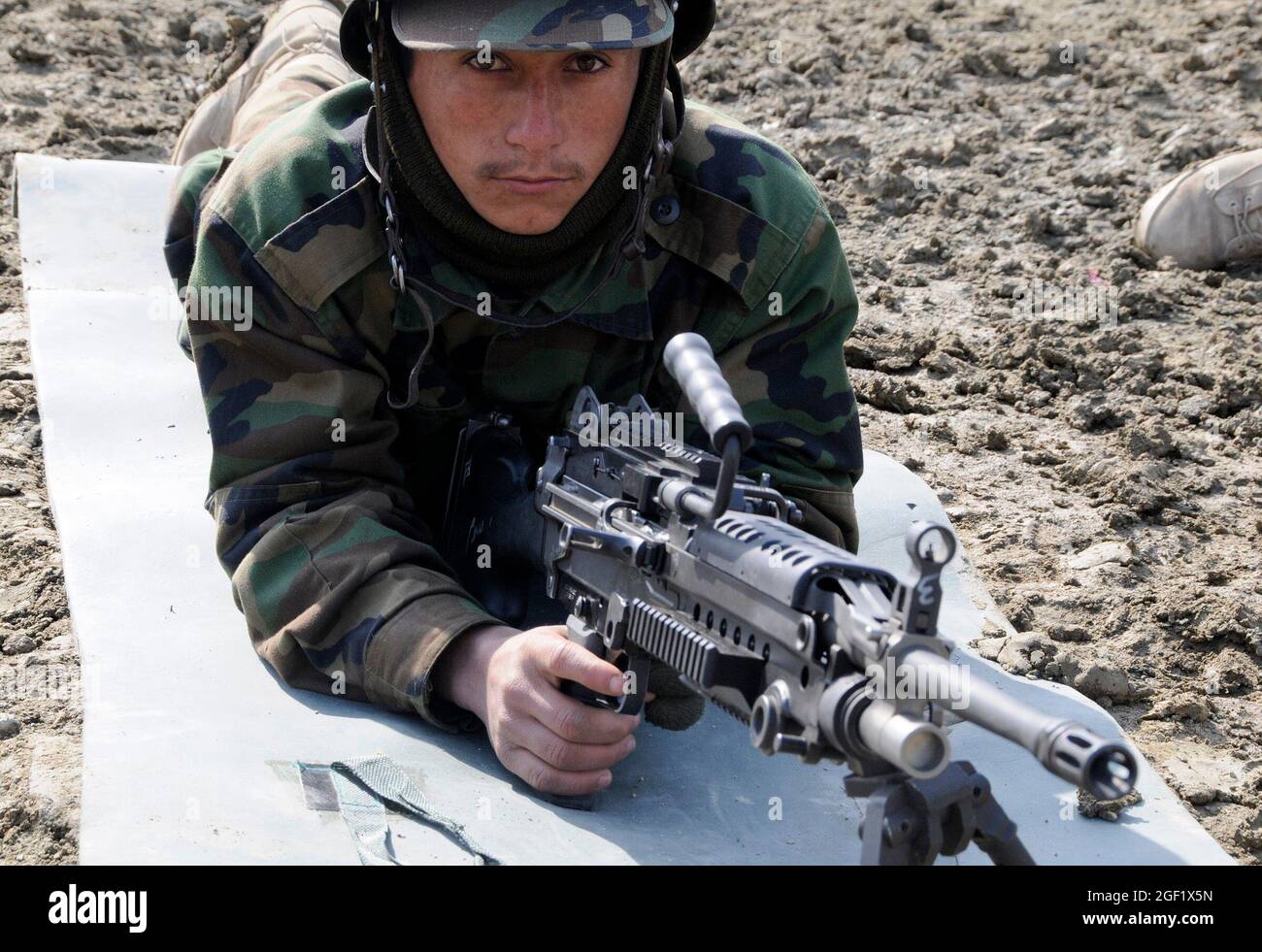 An Afghan National Army trainee waits to start the hand's-on portion of ...