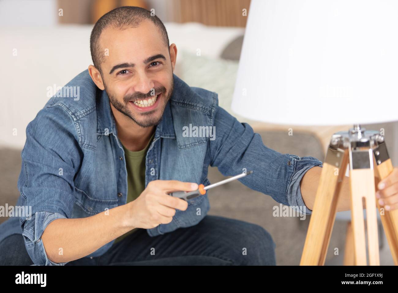 Hand twists bulb hi-res stock photography and images - Alamy