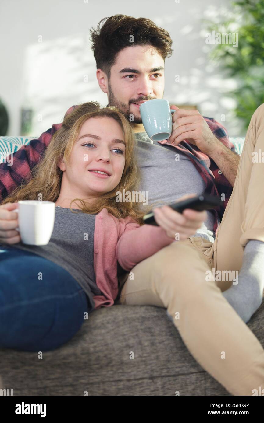 Couple chilling on sofa hi-res stock photography and images - Alamy