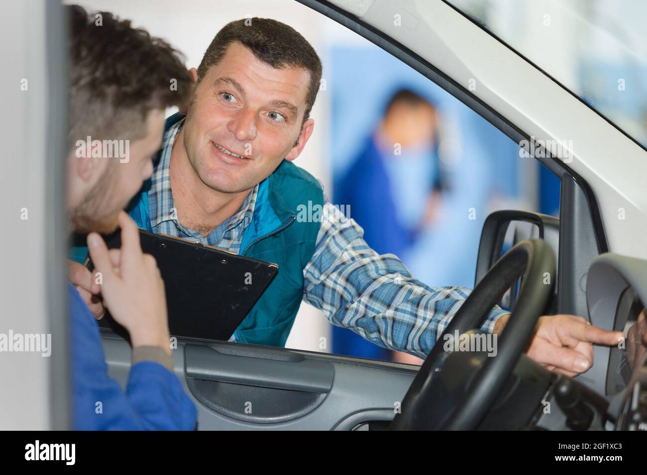 mechanic working on car enginee Stock Photo - Alamy