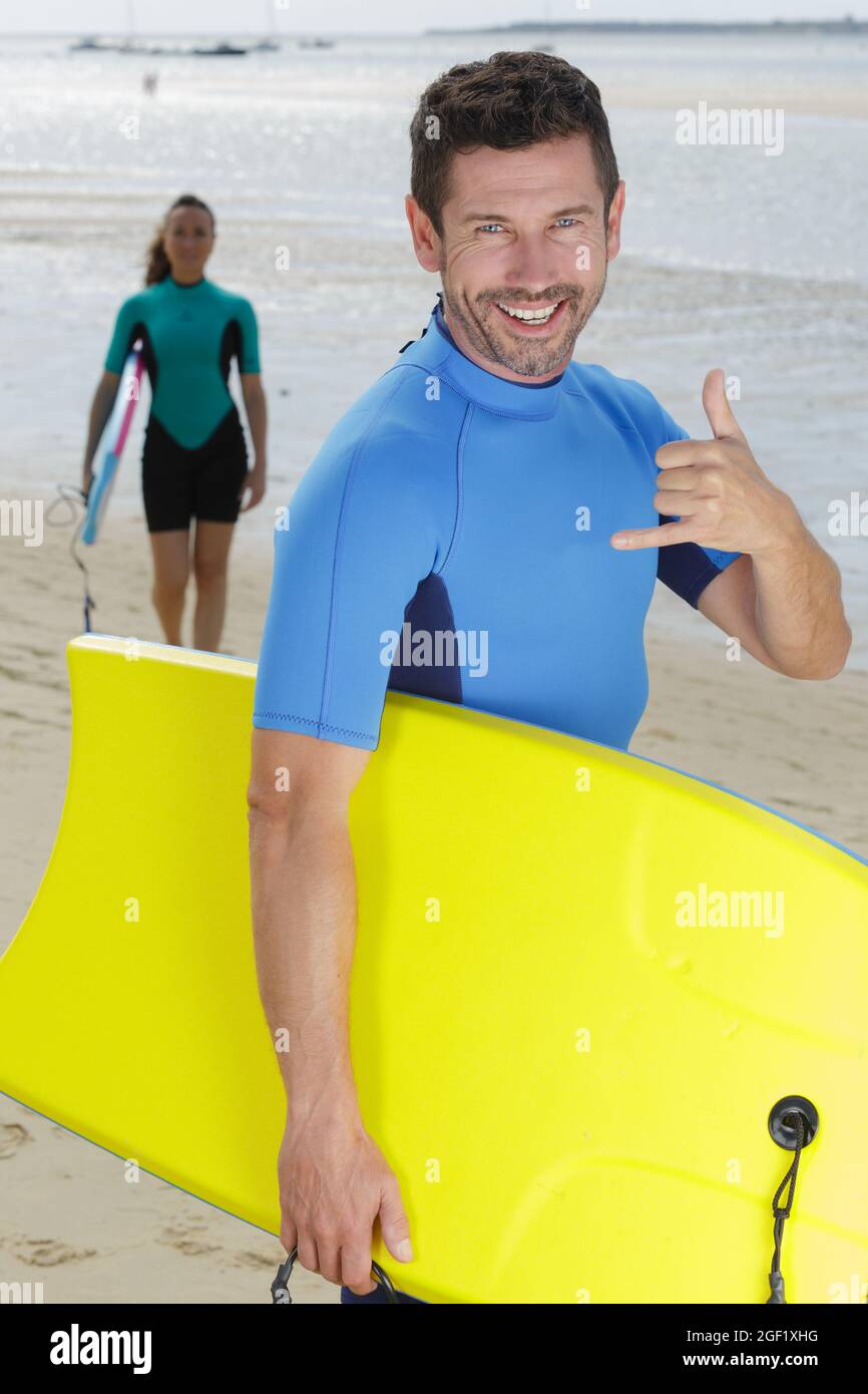 male surfer making the shaka hand gesture Stock Photo - Alamy