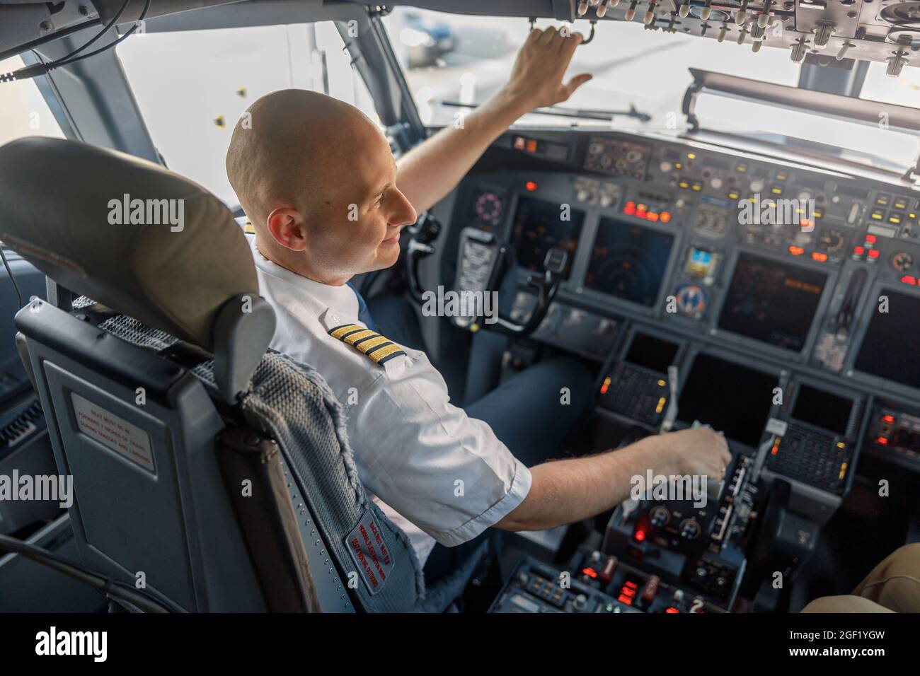 High angle view of professional pilot sitting in an airplane cabin, ready for takeoff Stock ...