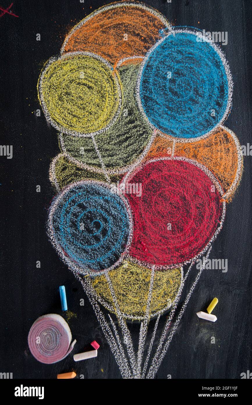 Graphic representation of colored balloons drawn with chalk on ...