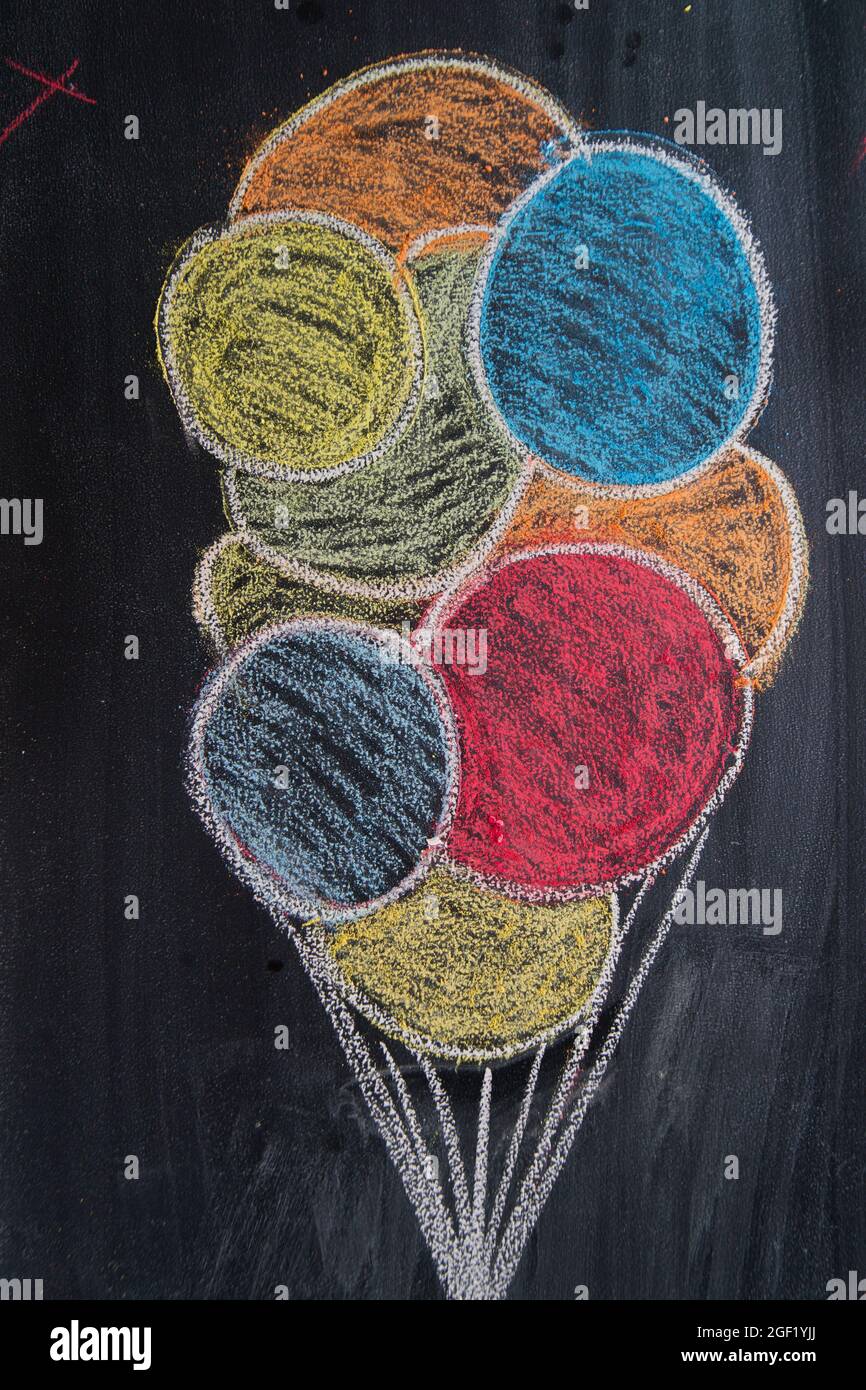 Graphic representation of colored balloons drawn with chalk on ...