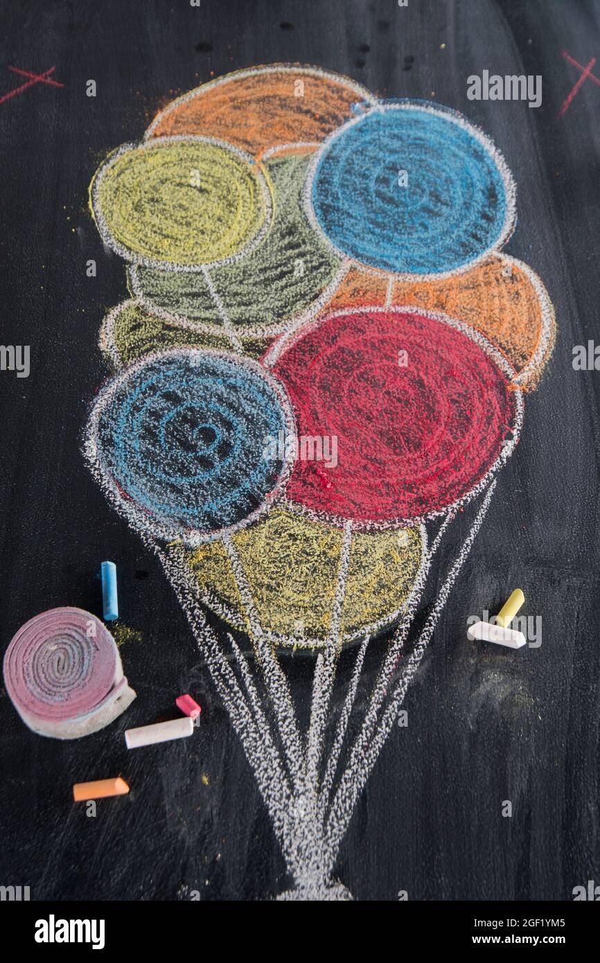 Graphic representation of colored balloons drawn with chalk on ...