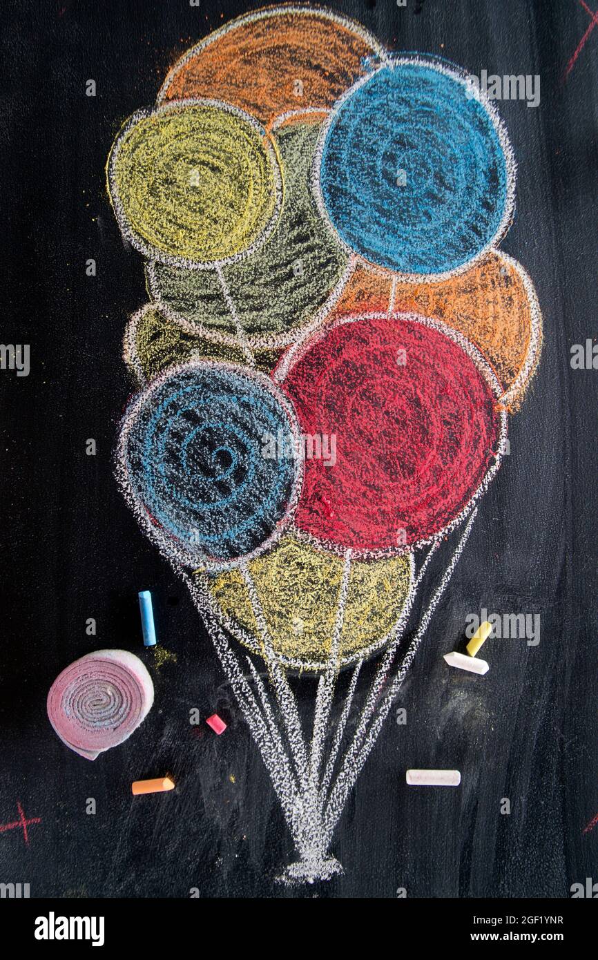 Graphic representation of colored balloons drawn with chalk on ...