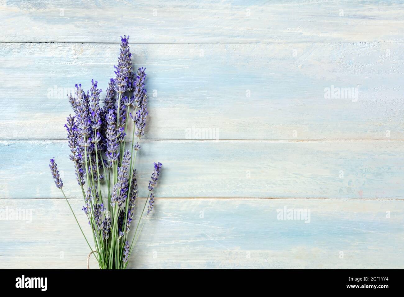 Lavender flower bouquet, overhead shot on a rustic wooden background ...