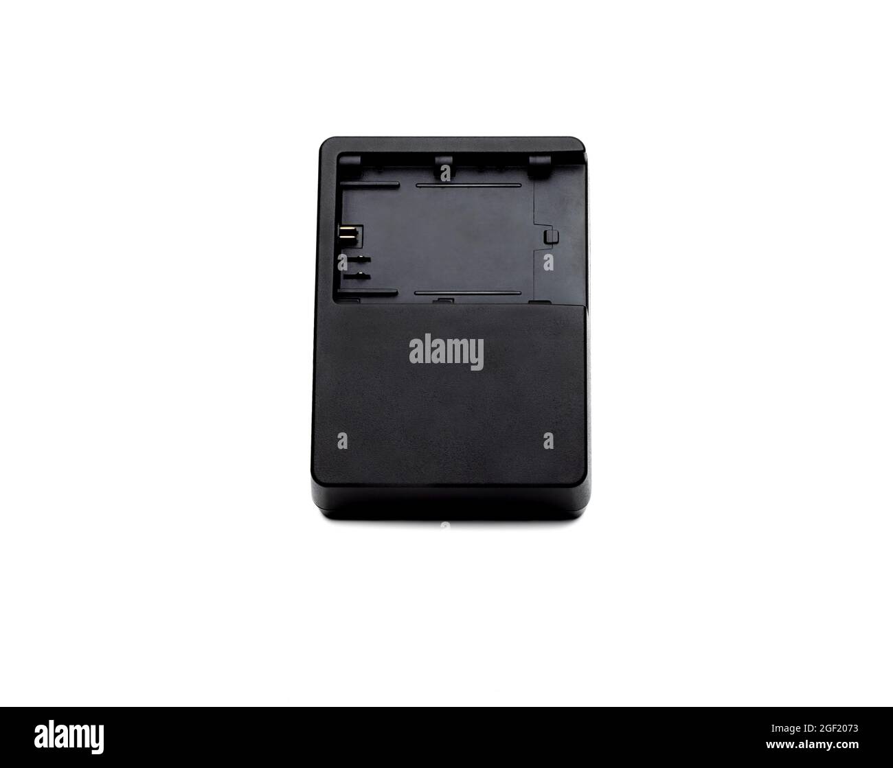 Used black old camera charging adapter on isolated white background ...