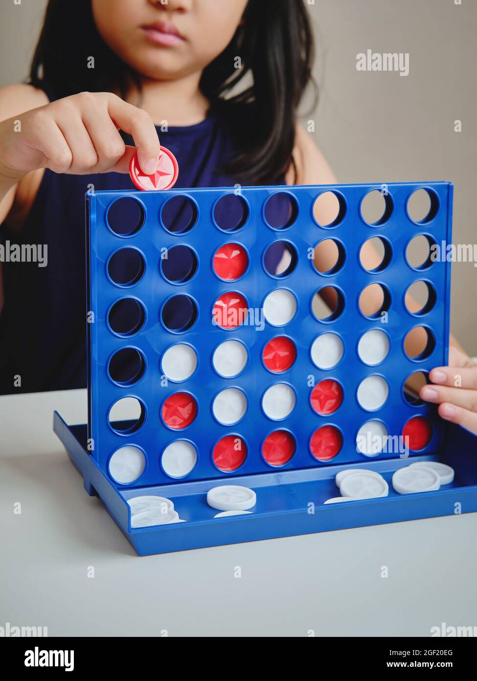 Little Girl Playing Four In A Row, 4 In Line Game, Game Education Toys ...