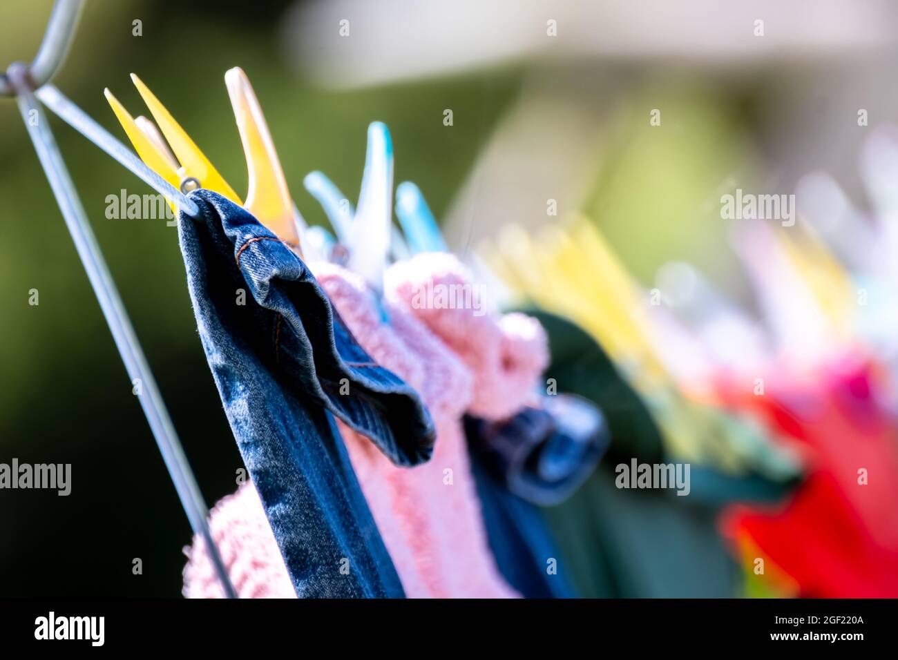 Drying laundry on the clothesline close up outdoors Stock Photo - Alamy