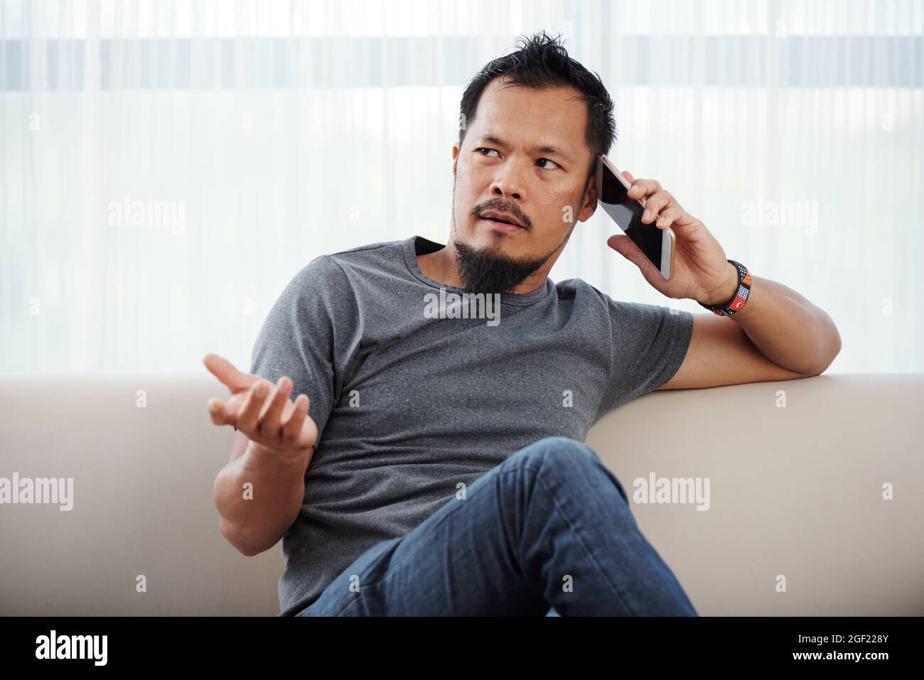 Filipino man on the phone hi-res stock photography and images - Alamy