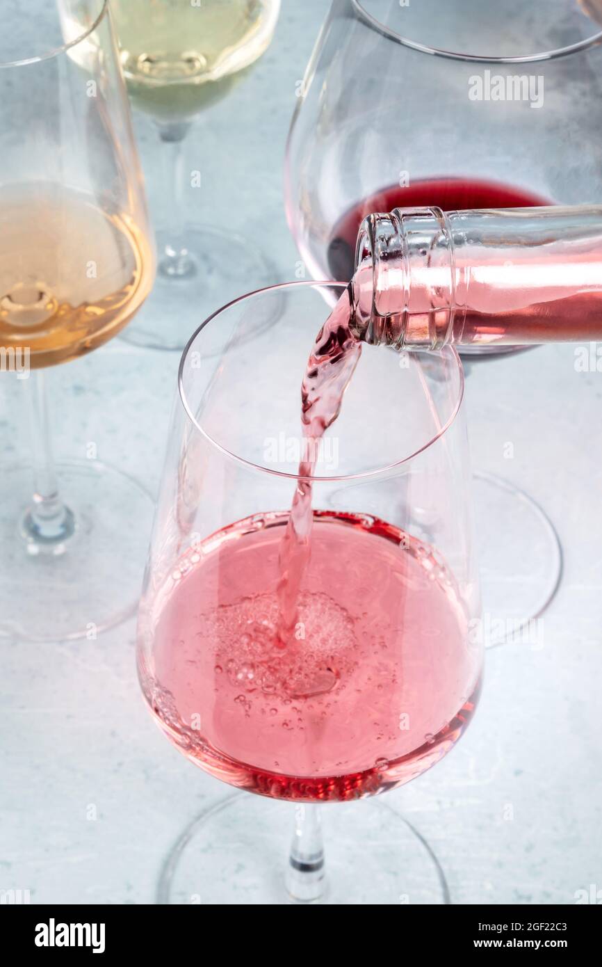 Rose wine poured at a tasting. Various colors of wine. Winetasting ...
