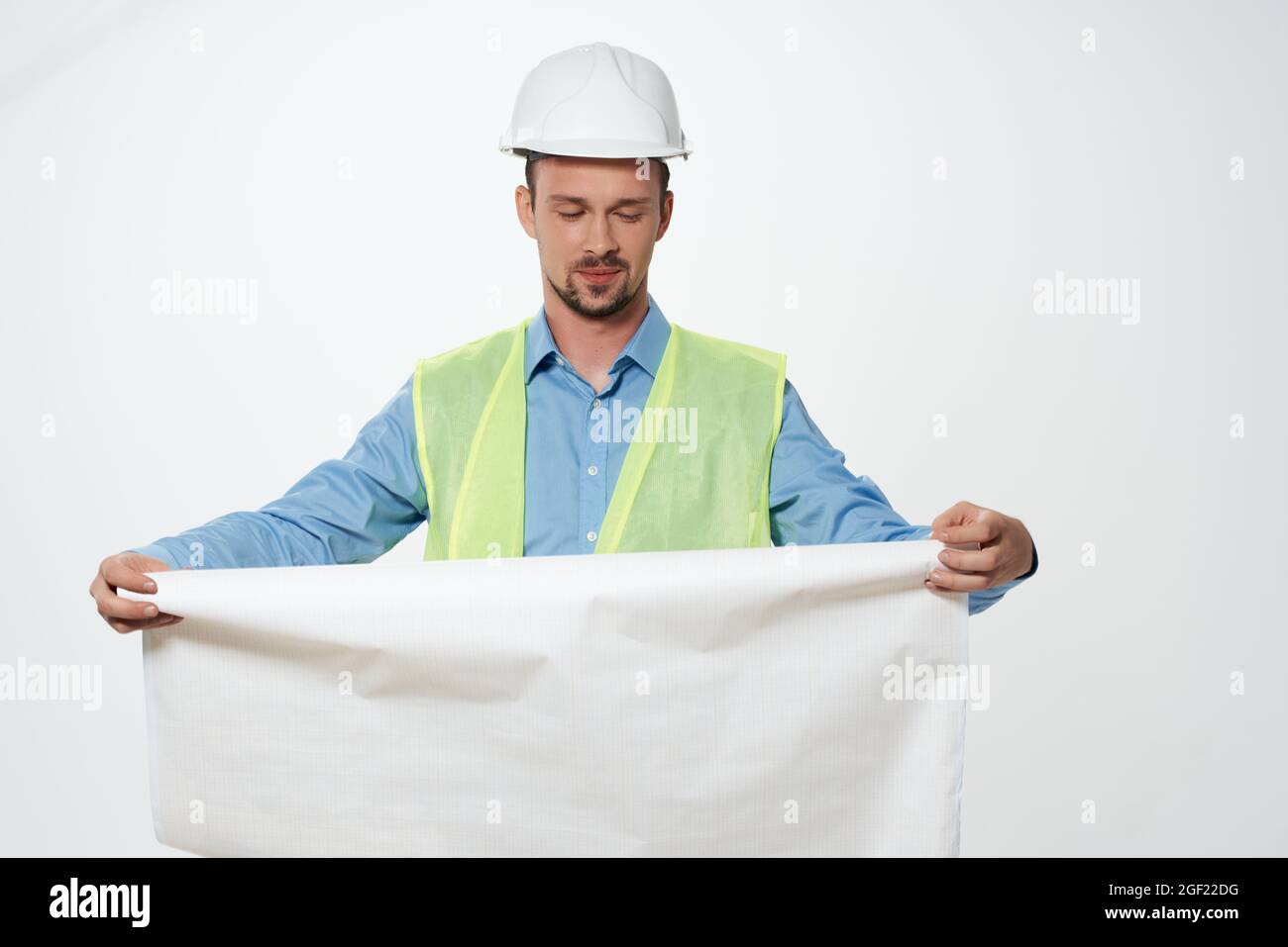 man reflective vest engineer light background Stock Photo - Alamy