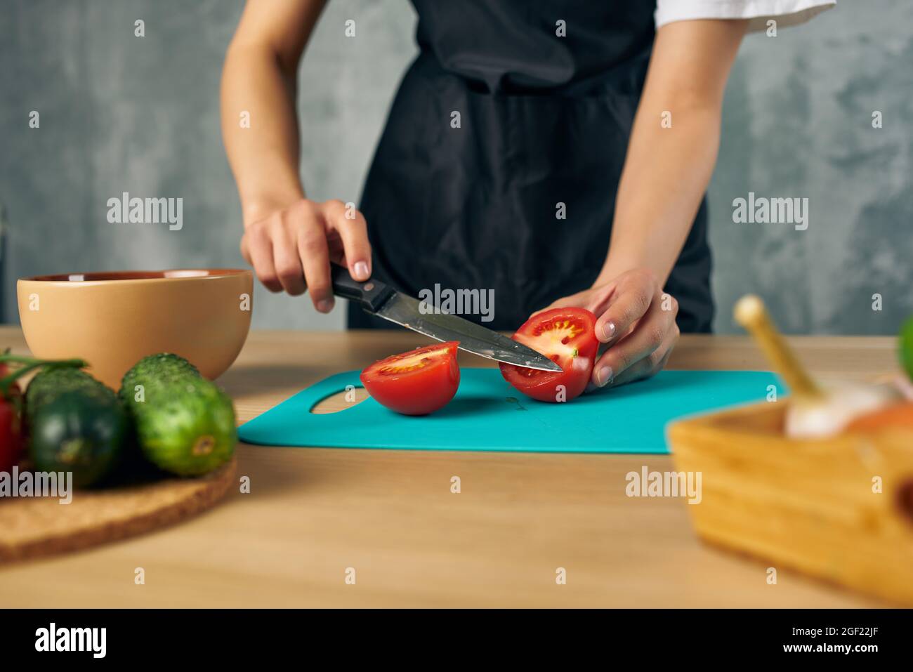 Cook in black apron Cooking healthy eating cutting board Stock Photo ...