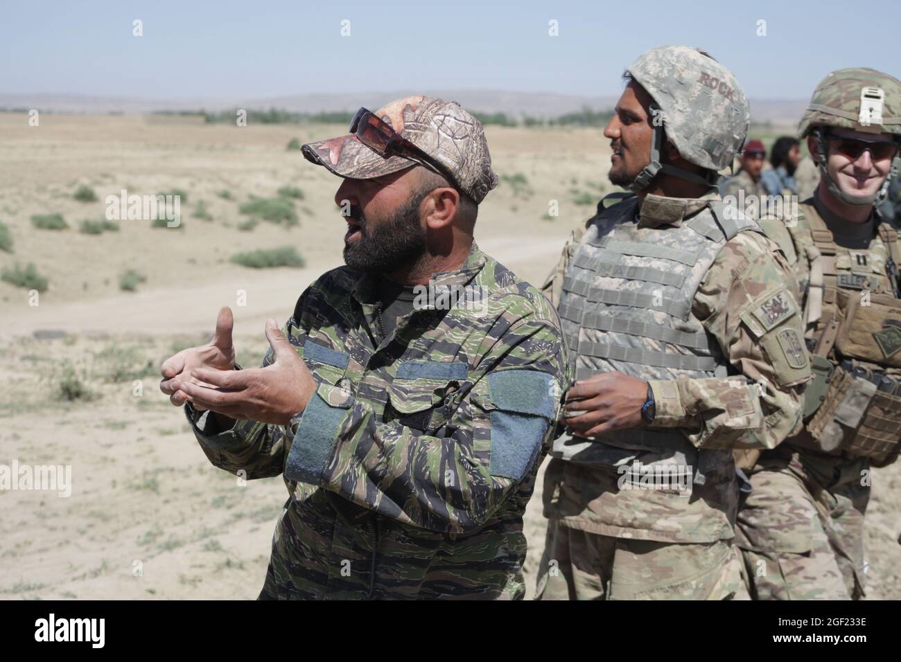 An Afghan National Army commander directs his troops during a route ...