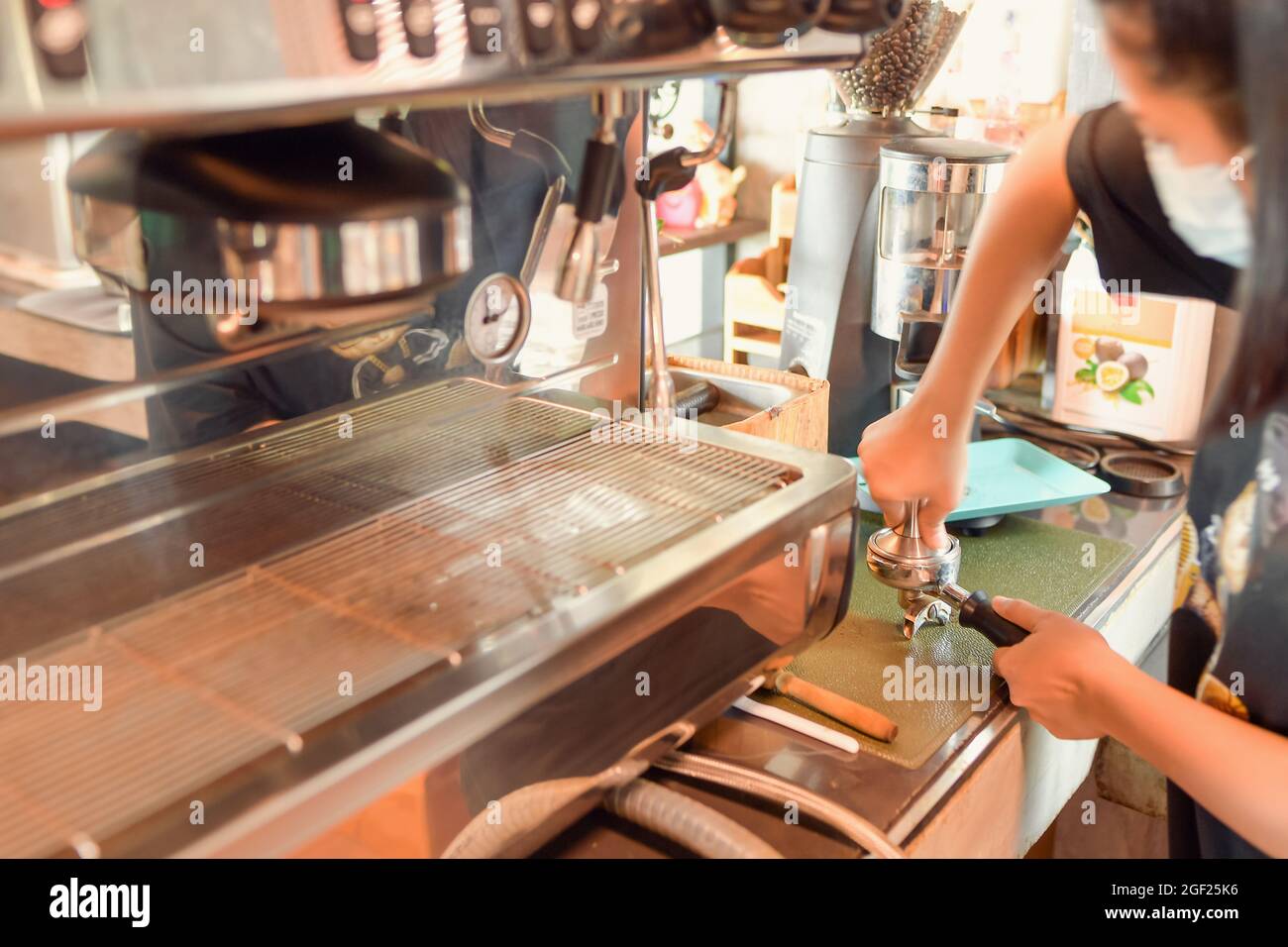 Barista make coffee latte art with espresso machine in cafe vintage ...