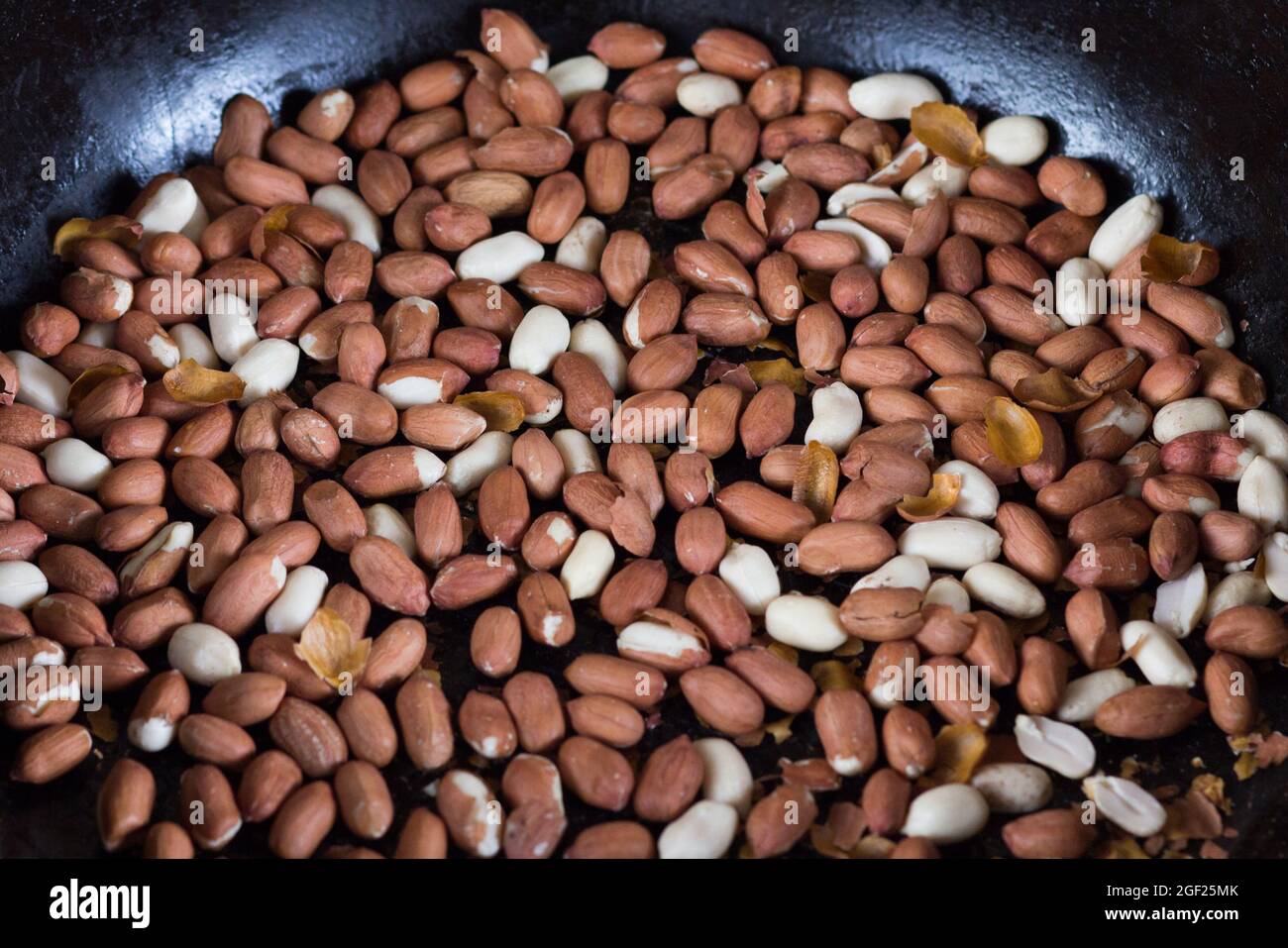 Top view of peanut with seed coat frying on pan Stock Photo - Alamy