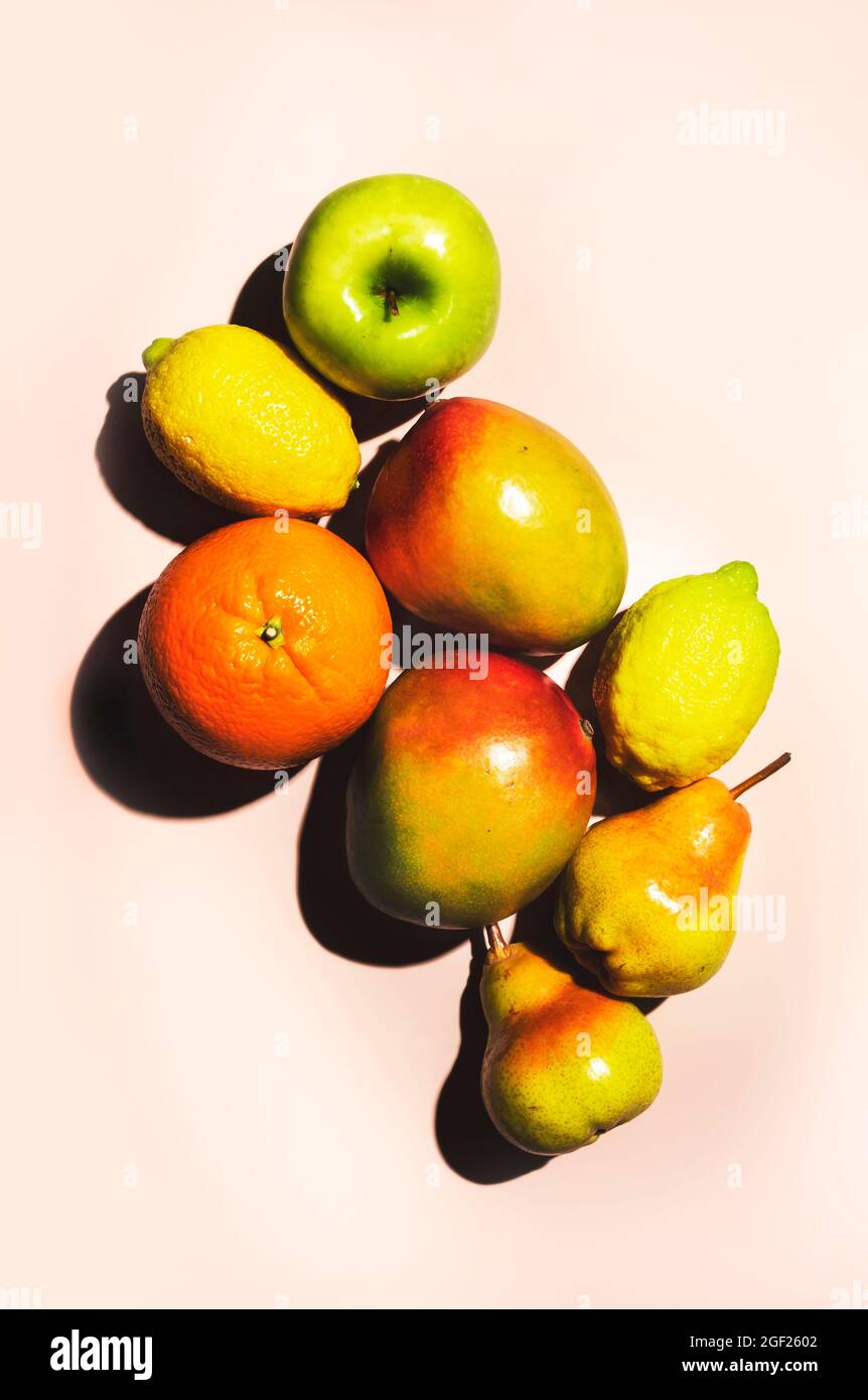 Summer fruits top view. Contemporary still life, lime green background ...