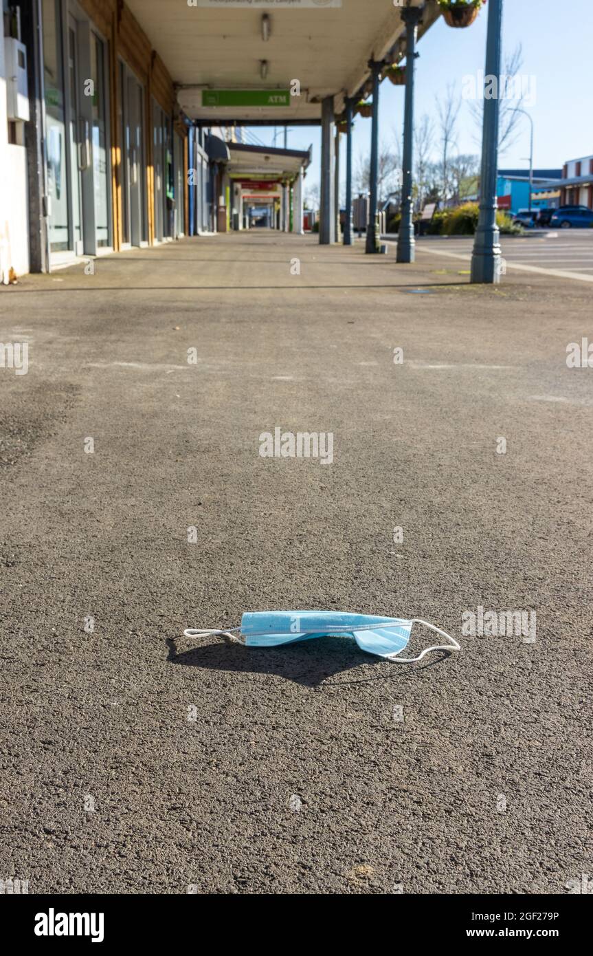 Covert-19 face mask left at a empty town main street because of Covert ...