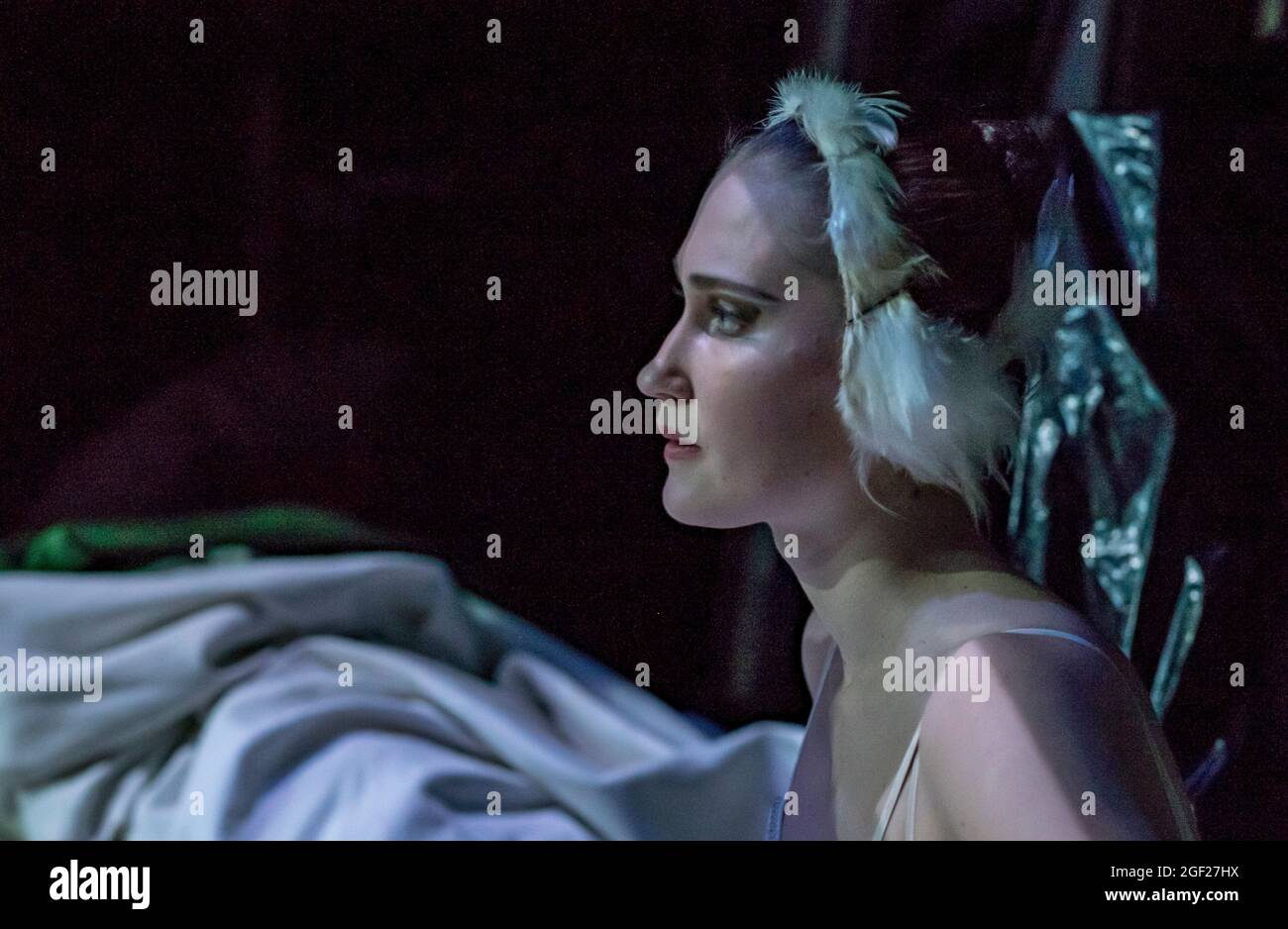 Ballerina waits backstage for the appropriate cue for her entrance in a ...