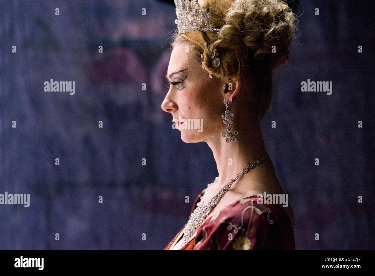 Ballerina waits backstage for the appropriate cue for her entrance in a ...