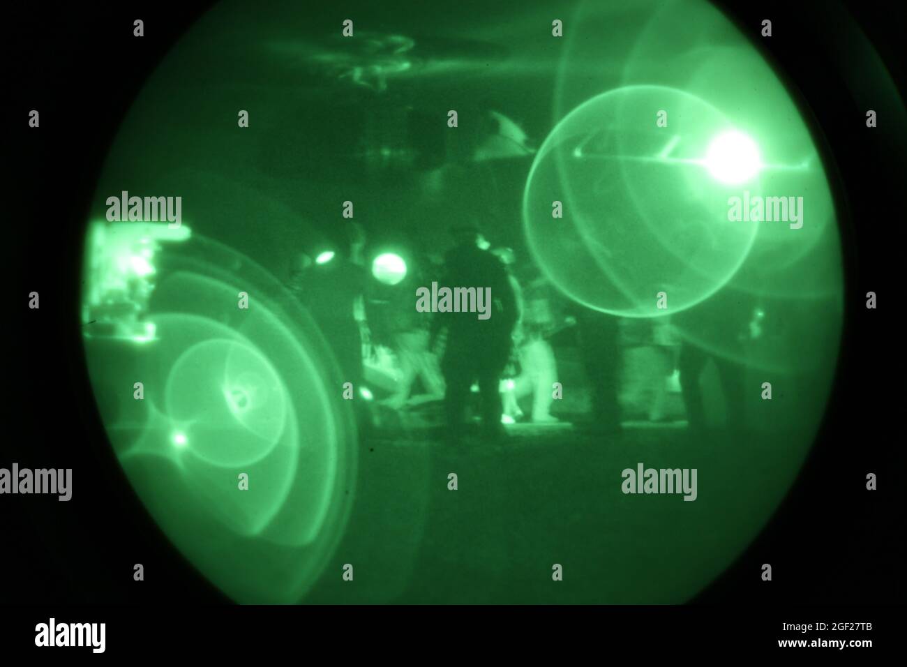 A construction helicopter offloads supplies on the flight line at ...